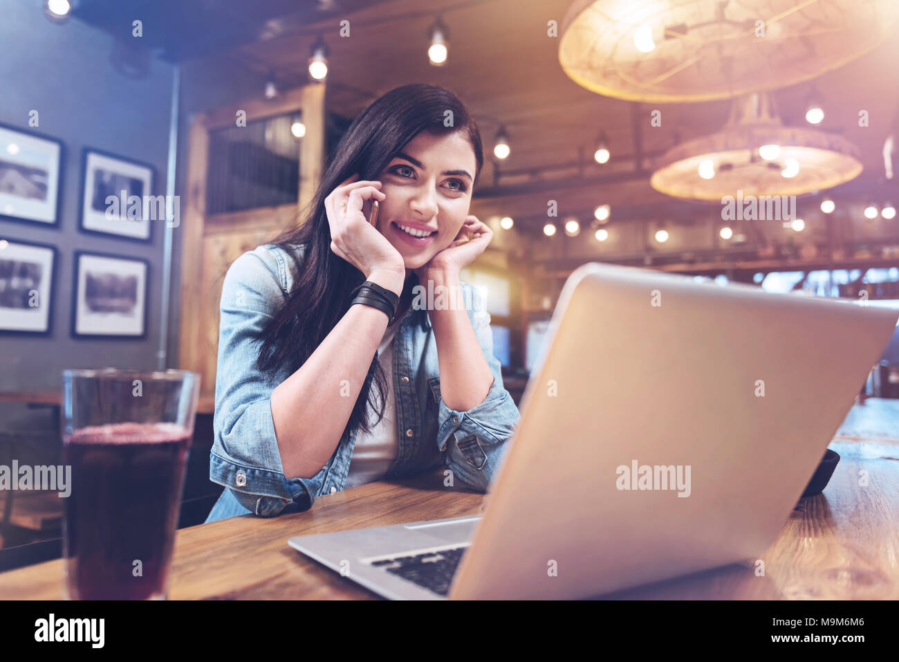 Positive happy woman calling her friend Stock Photo - Alamy