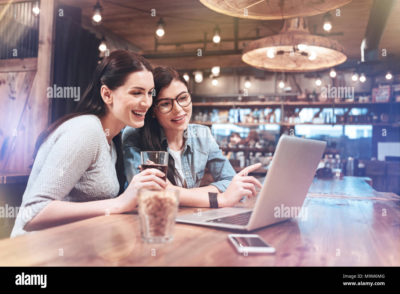 Happy nice women having fun Stock Photo - Alamy