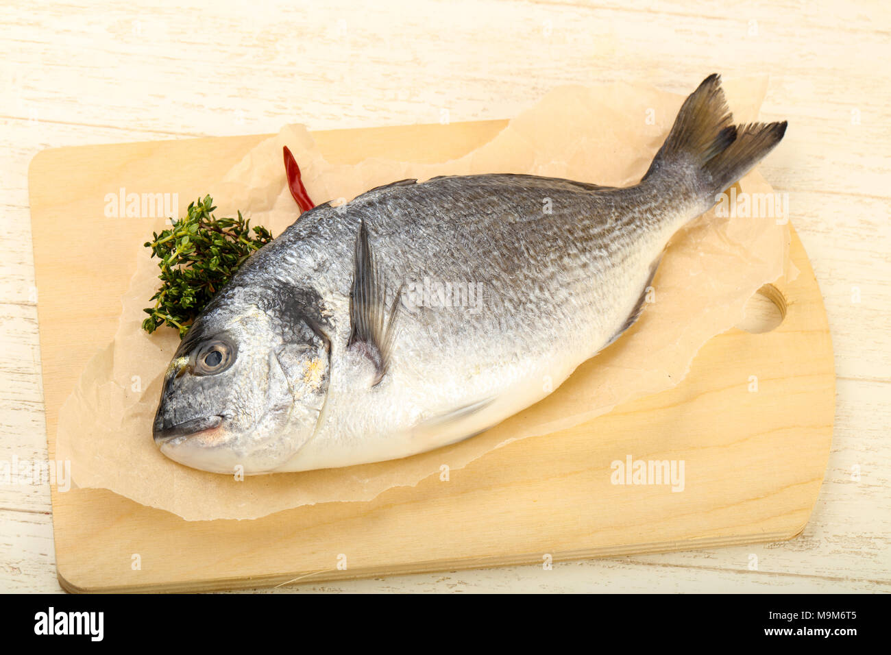 raw dorada fish - ready for cooking Stock Photo - Alamy