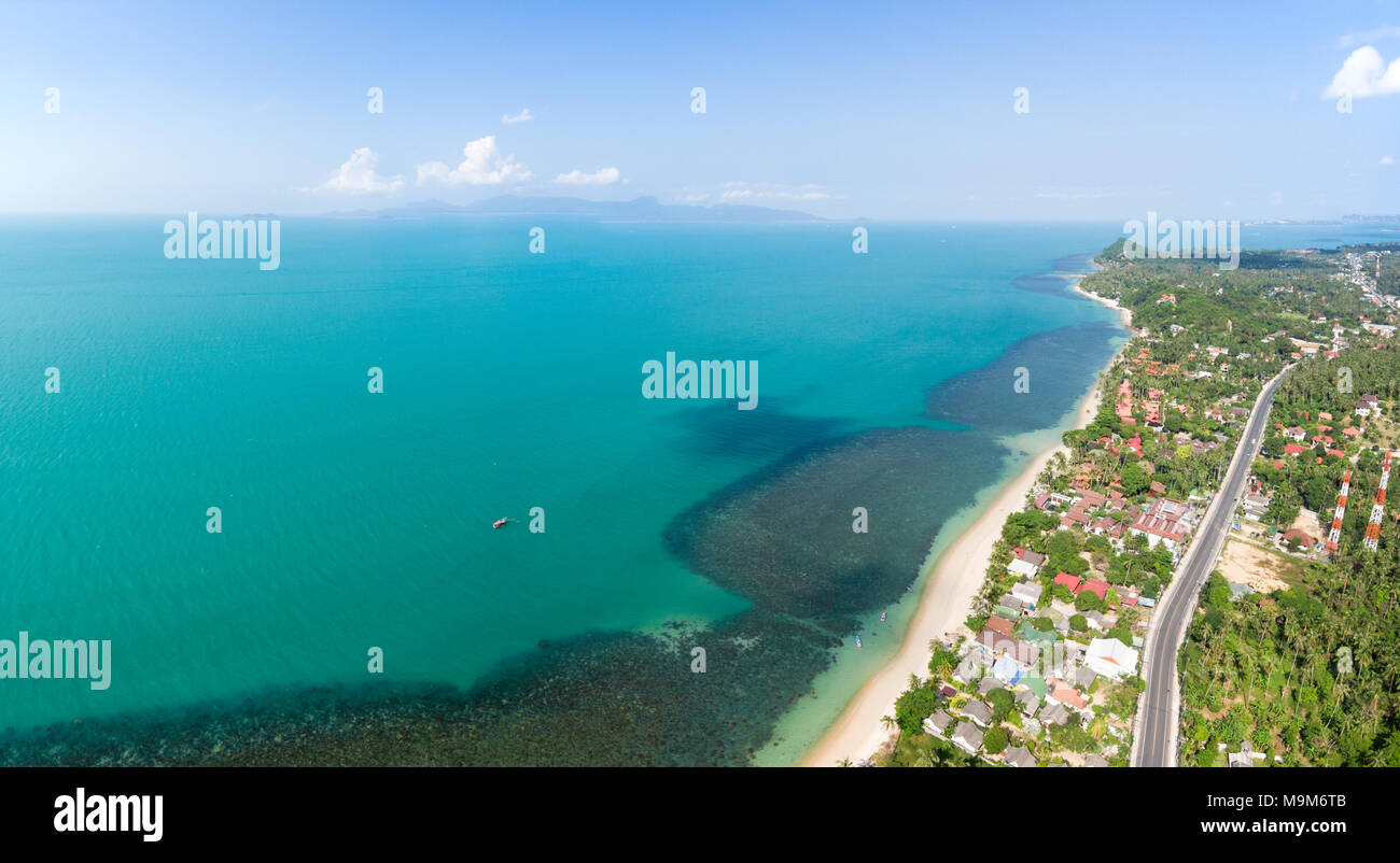 Aerial panoramic view of ocean, beach and blue cloudy sky, Koh Samui ...