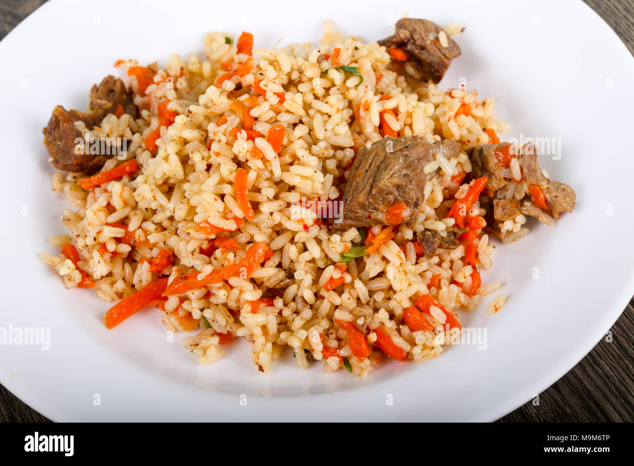 Asian rice - Plov with meat and carrot Stock Photo - Alamy