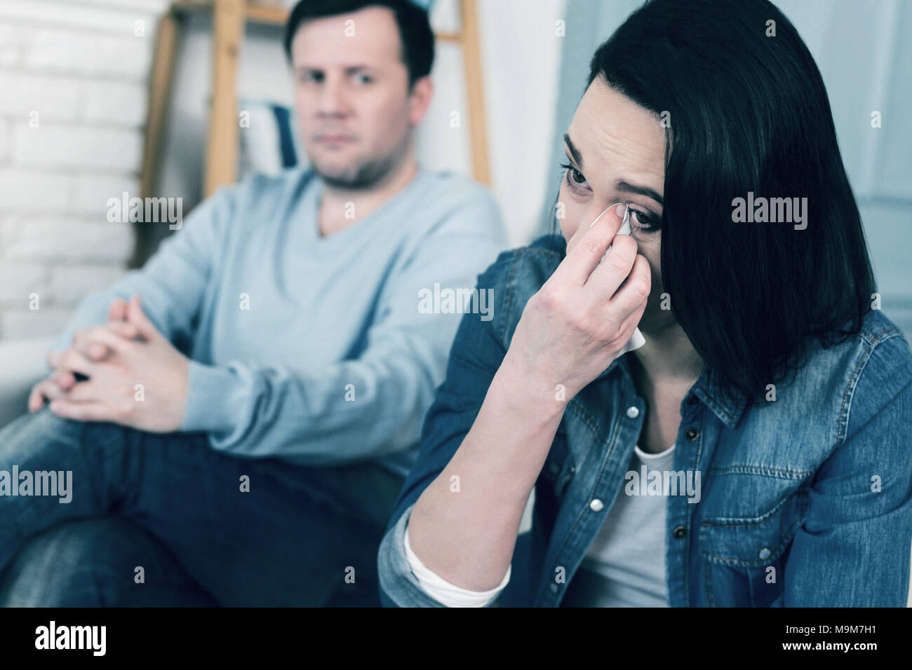 Man wiping tears woman hi-res stock photography and images - Alamy