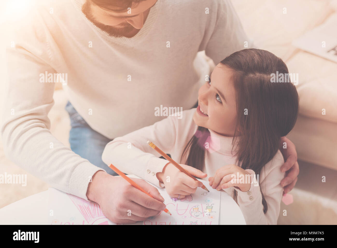 Emotional charming girl talking to her dad Stock Photo - Alamy