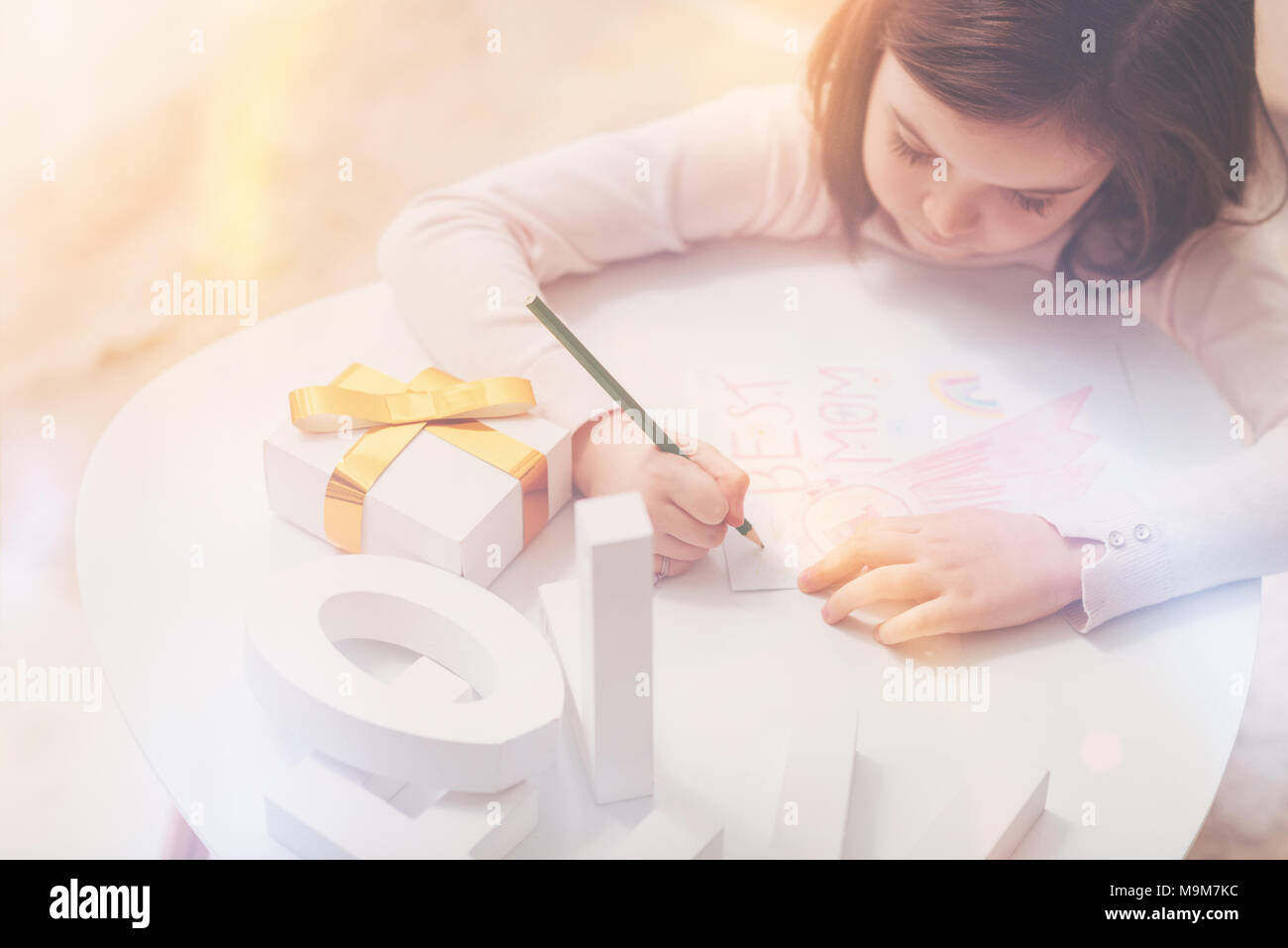 Creative child focused on the process Stock Photo - Alamy