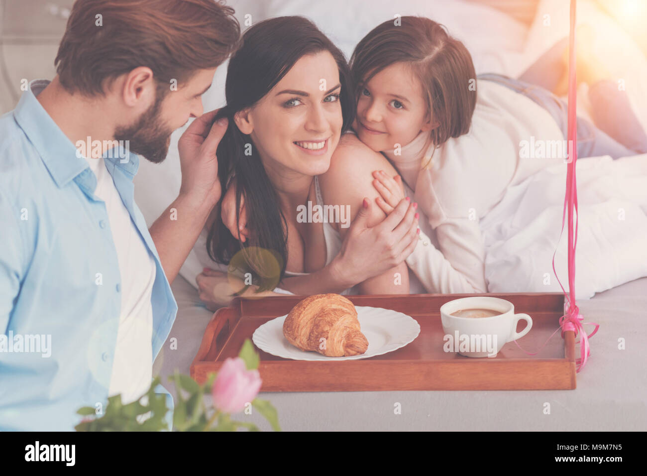 Picture of happy family in the morning Stock Photo - Alamy