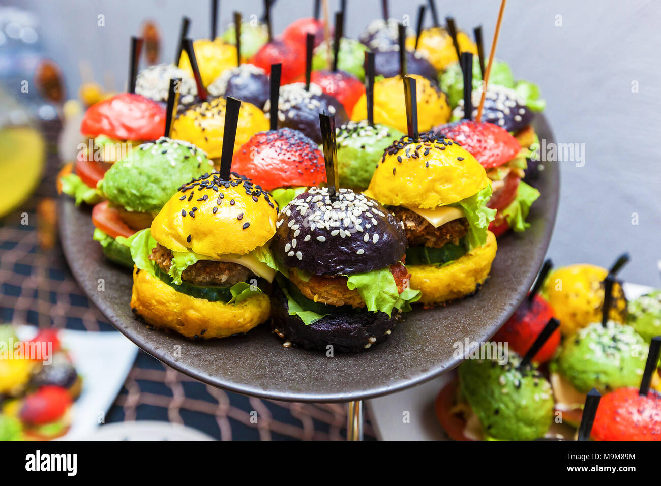Beautifully decorated catering banquet table with different colored ...