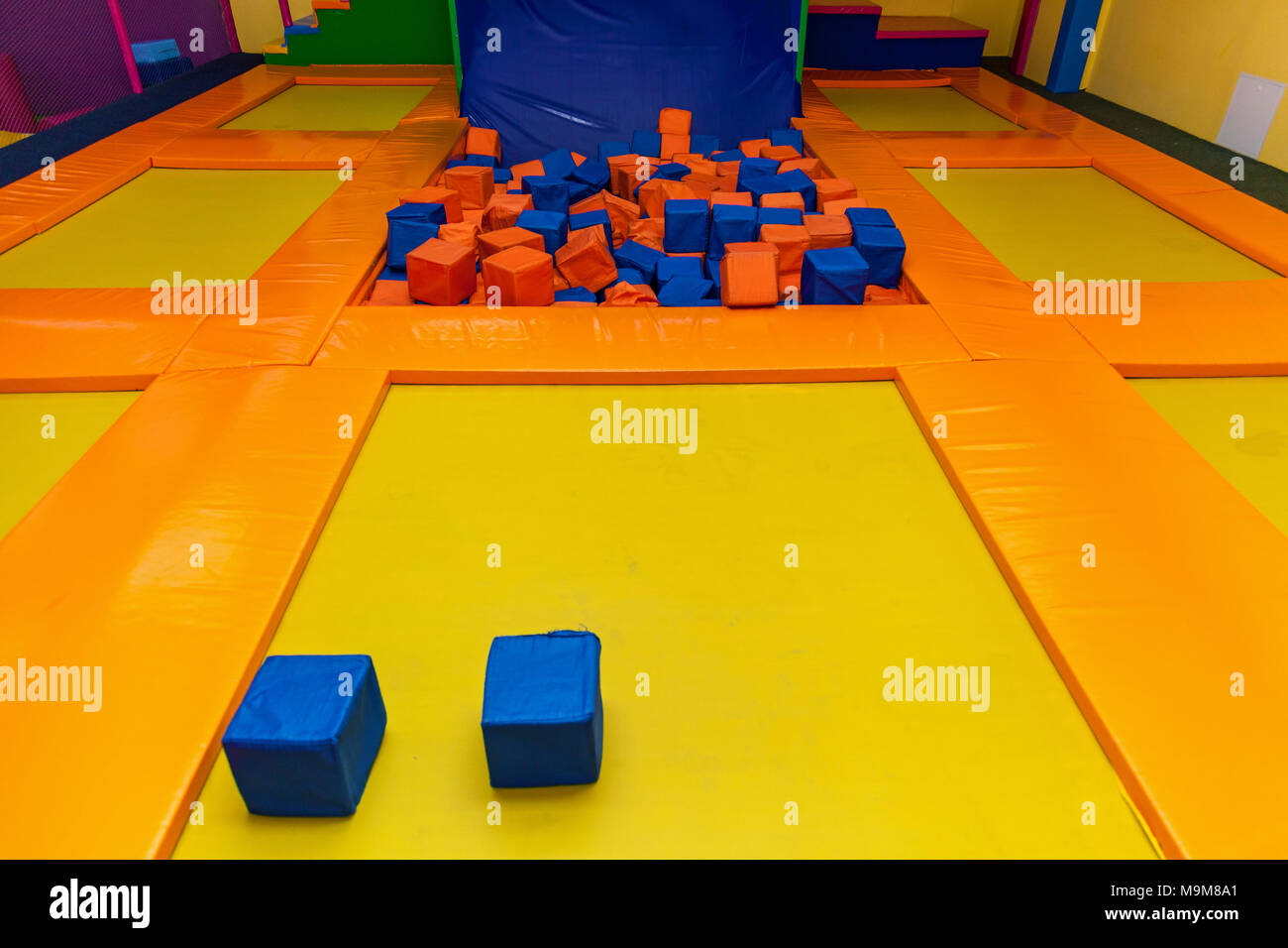 Yellow trampolines in the game room of the fitness center Stock Photo ...