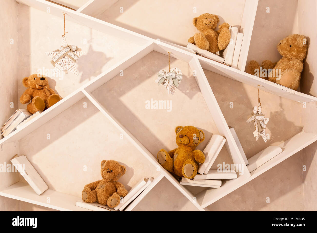 Many bear dolls on shelf at toy shop. A lot of teddy bears on the ...