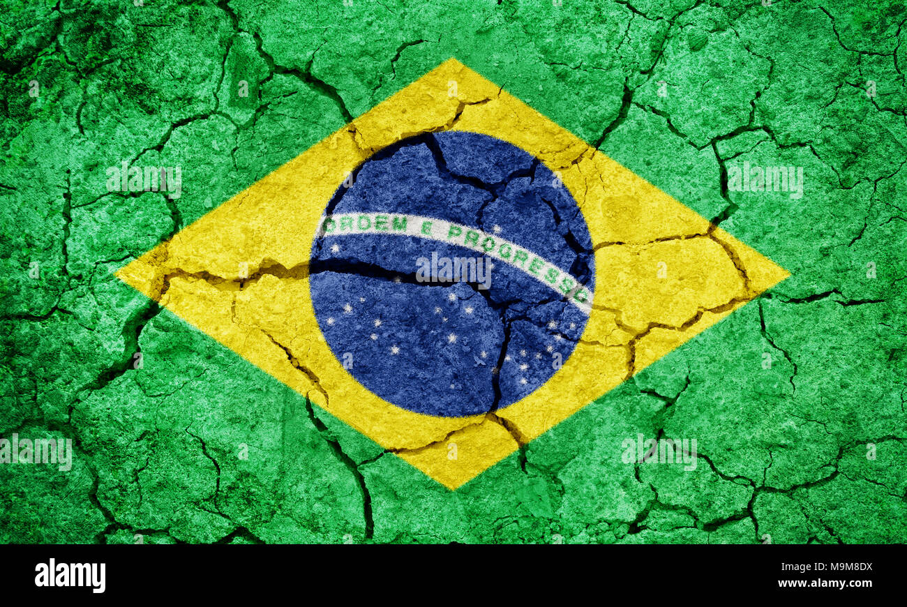 Brazil flag on dry earth ground texture background Stock Photo - Alamy