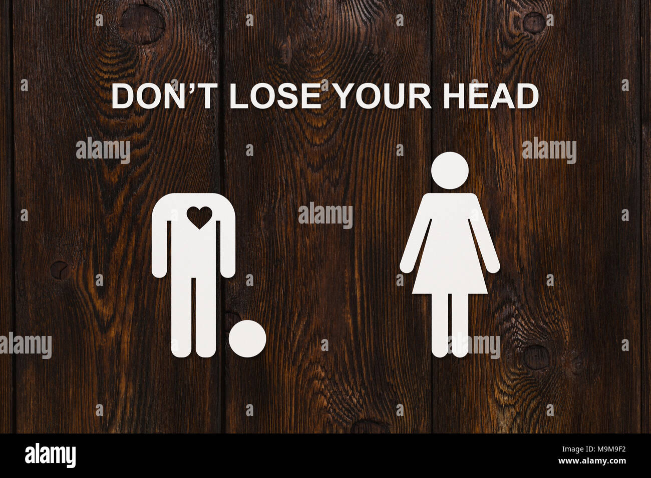 Paper man without head and woman with text DON'T LOSE YOUR HEAD. Love ...