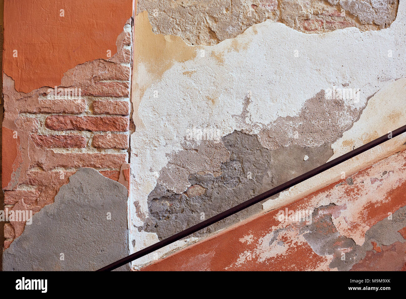 Flaking plaster wall in Italy Stock Photo - Alamy