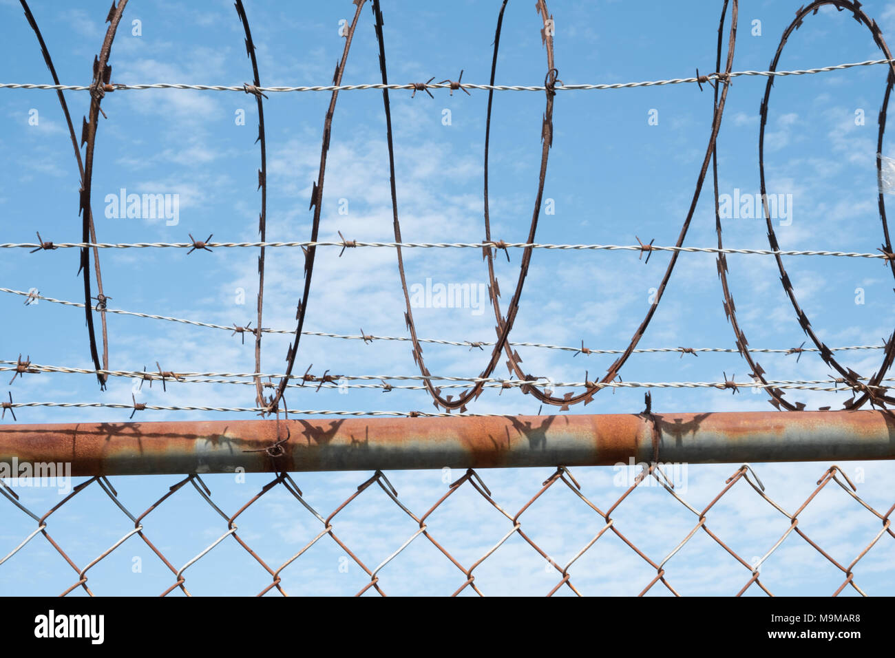 Barb wire fence guarded border hi-res stock photography and images - Alamy