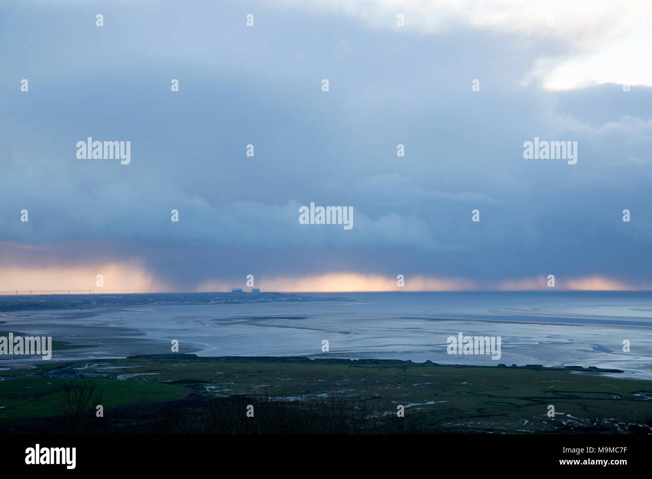Heysham nuclear power station on the shores of Morecambe Bay with storm ...