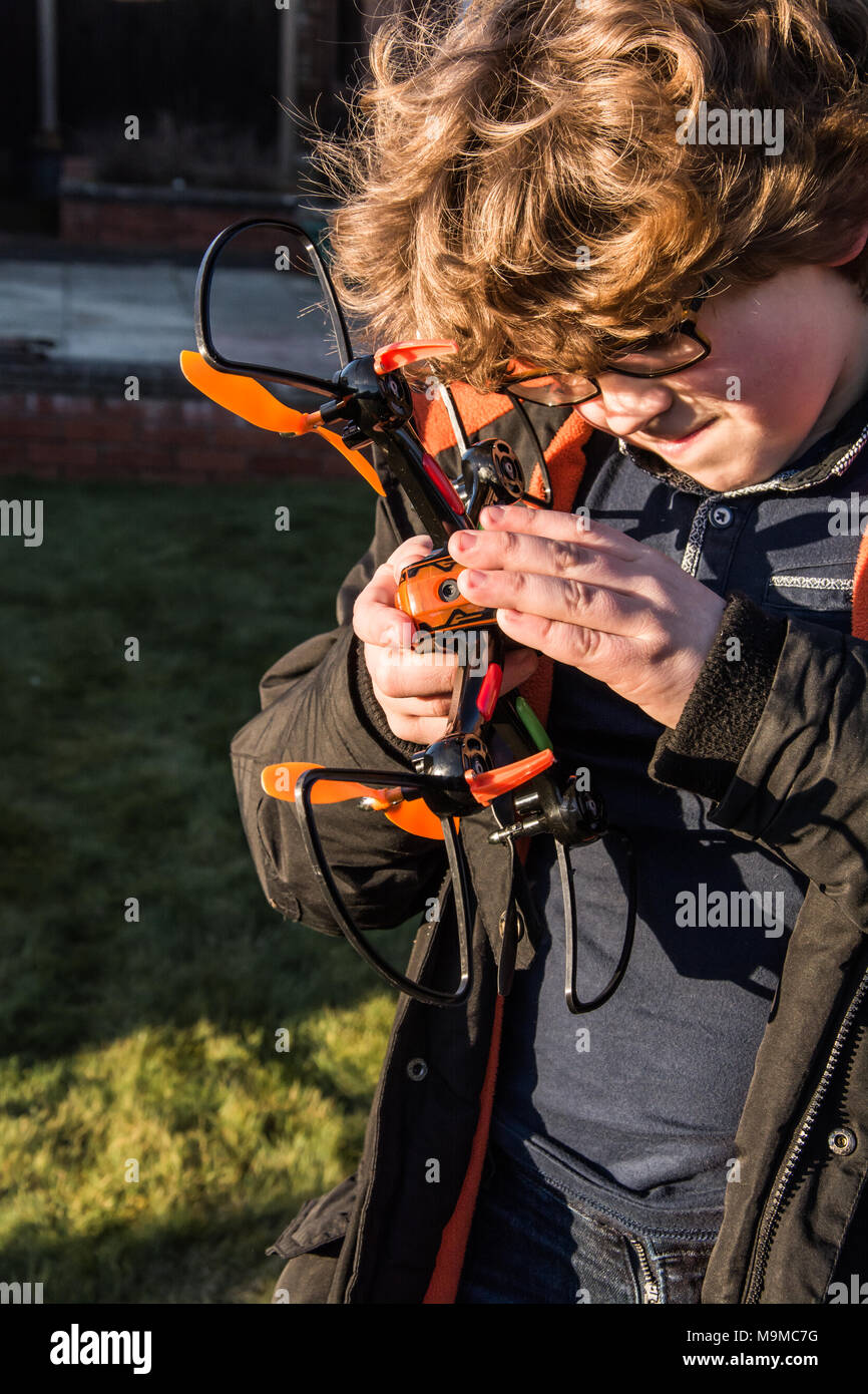 Boy putting battery hi-res stock photography and images - Alamy