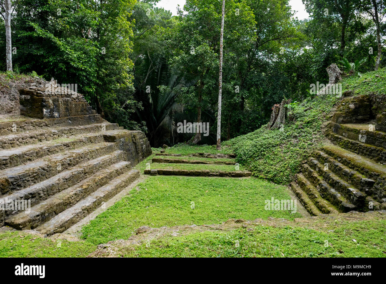 Ancient ball court ruins from the Mayan archeological site in Nakum ...