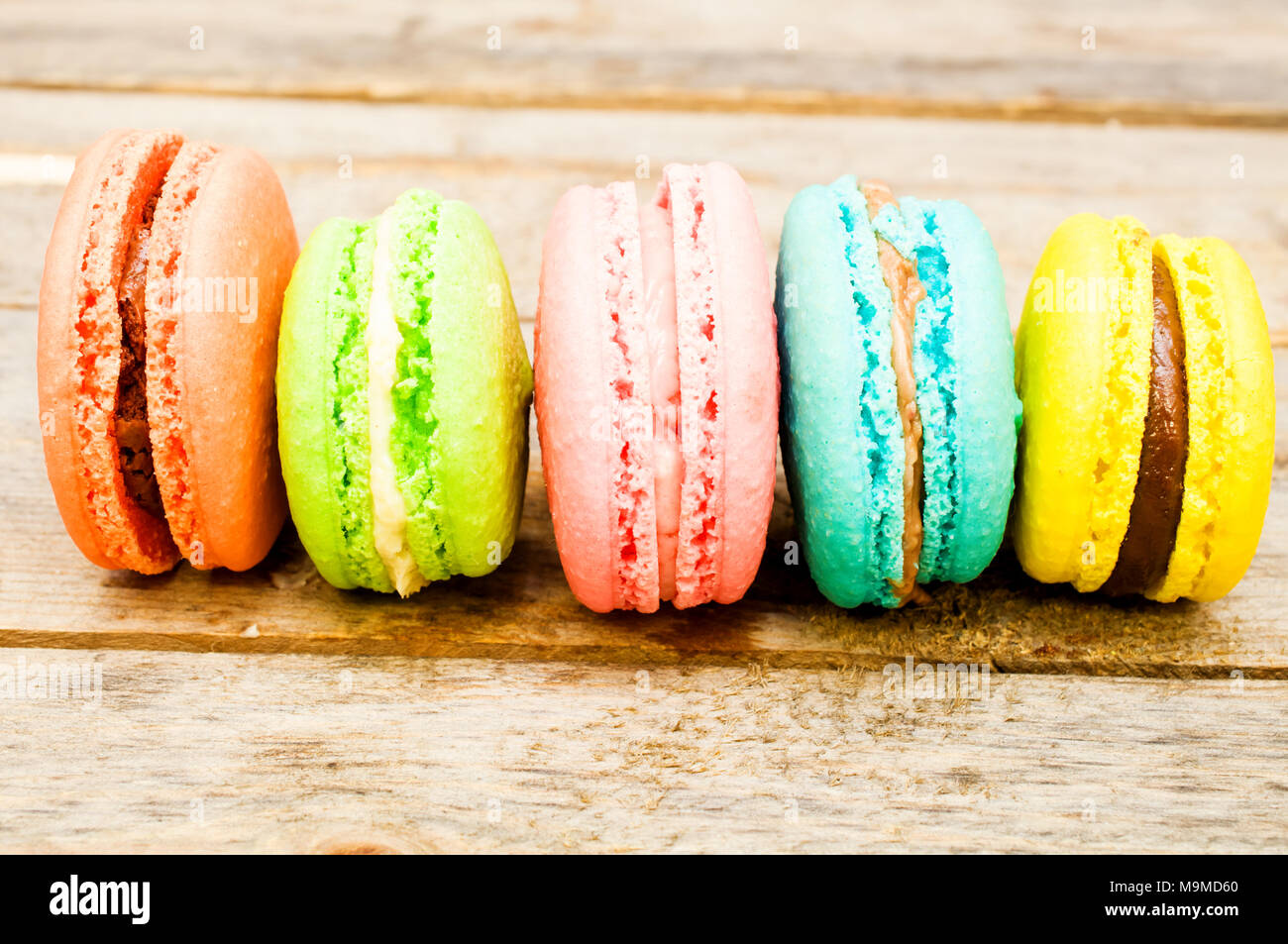 macaroon pastry set on a wooden table Stock Photo - Alamy