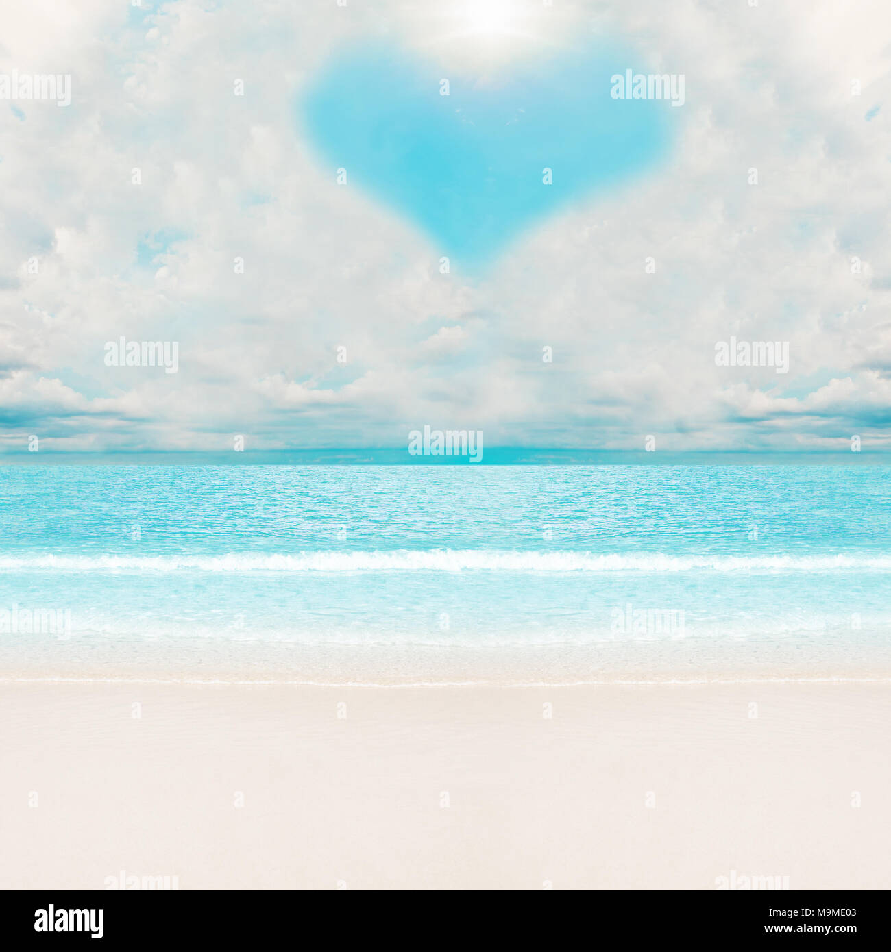 Love clouds over tropical beach Stock Photo - Alamy