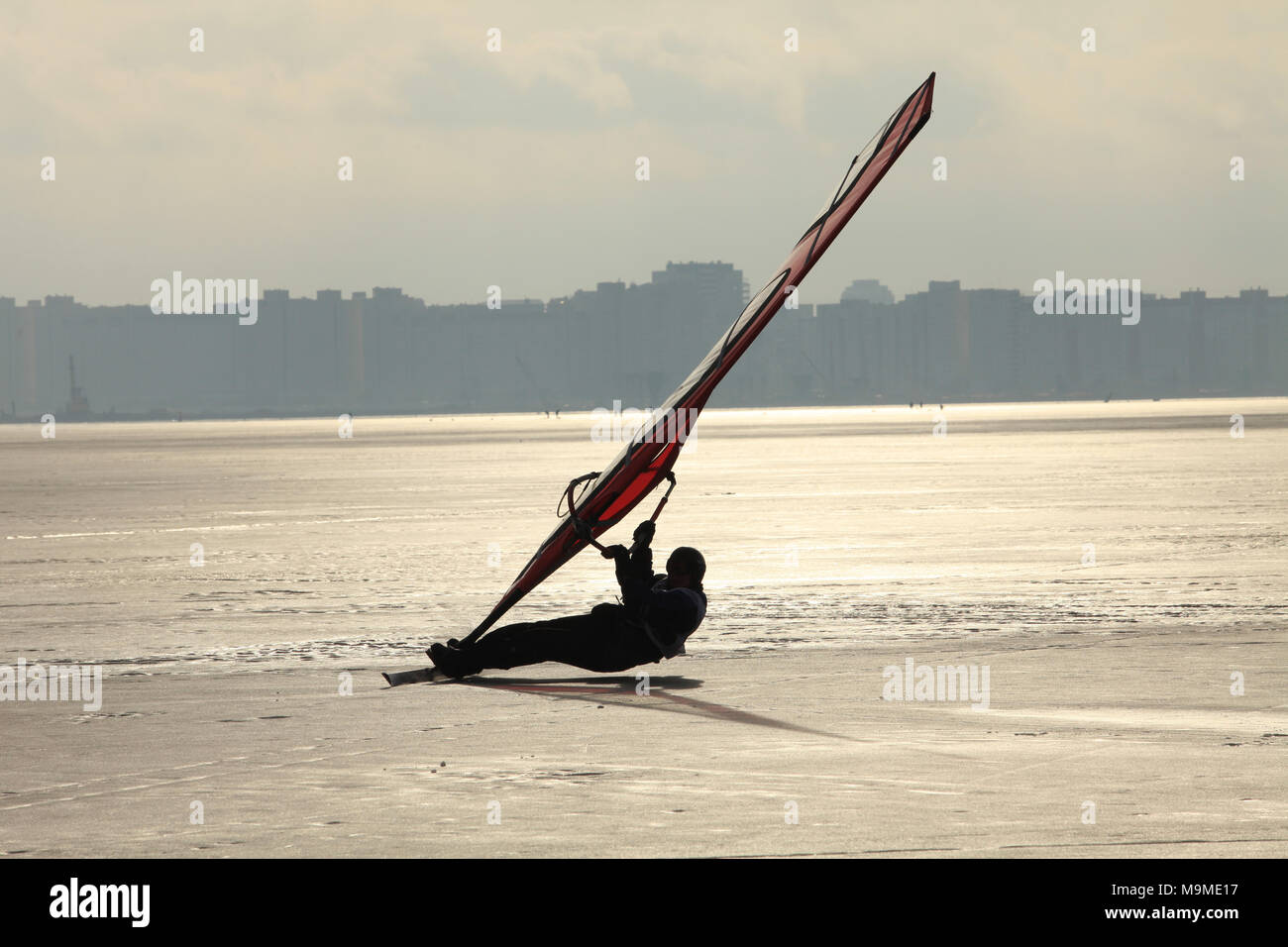 sailing in the winter windsurfing Stock Photo - Alamy