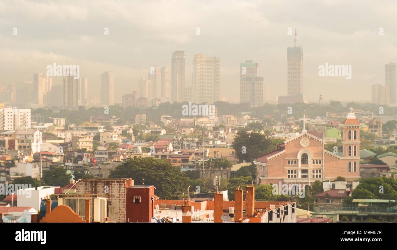 Panorama of the City of Manila with skyscrapers early in the morning ...