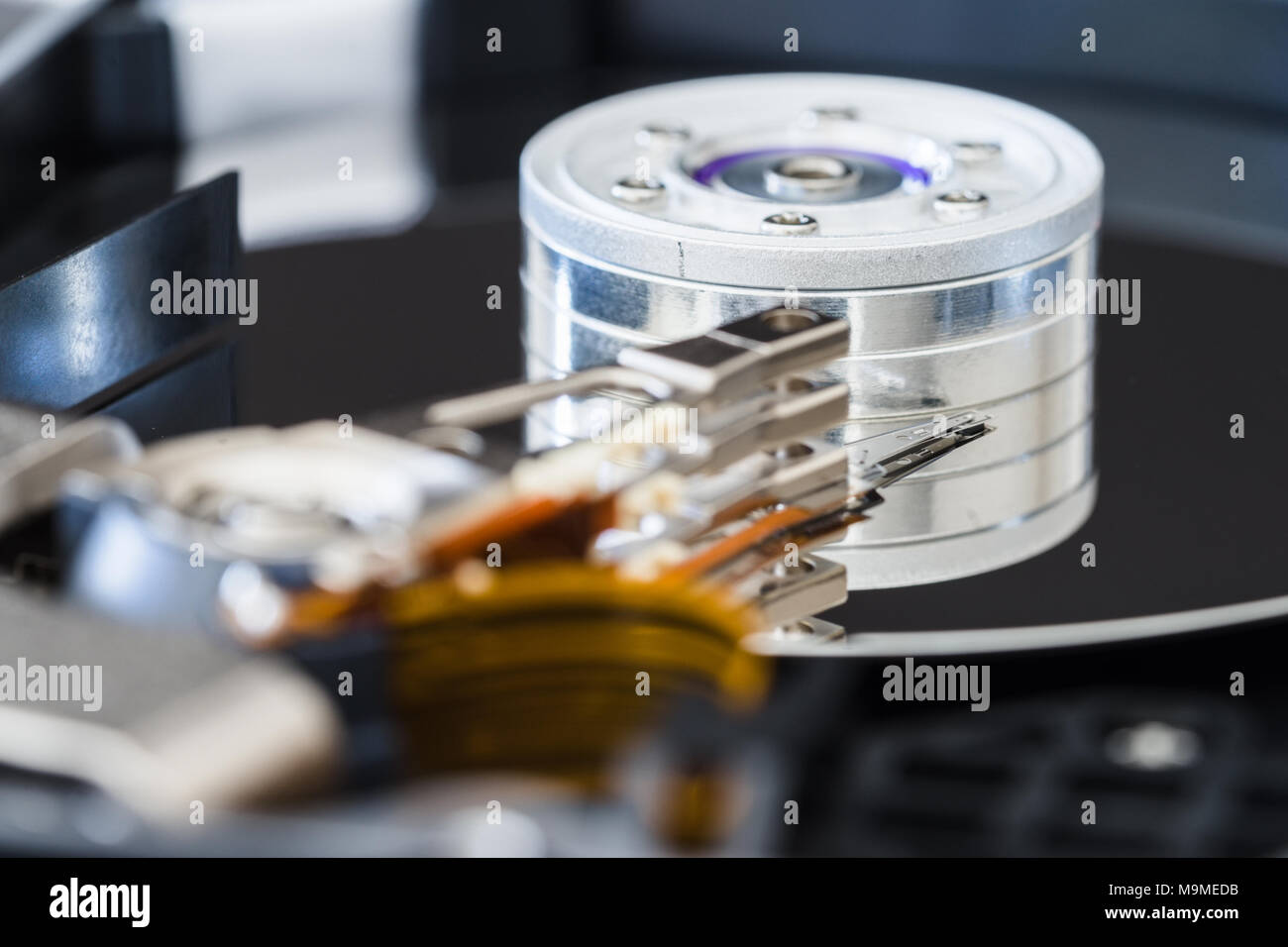 Hard disk drive inside close-up, spindle, actuator arm, read write head ...