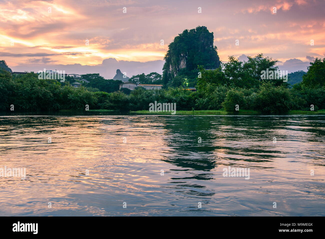 Sunset scene in Guilin, China, with stunning rock and river Stock Photo ...