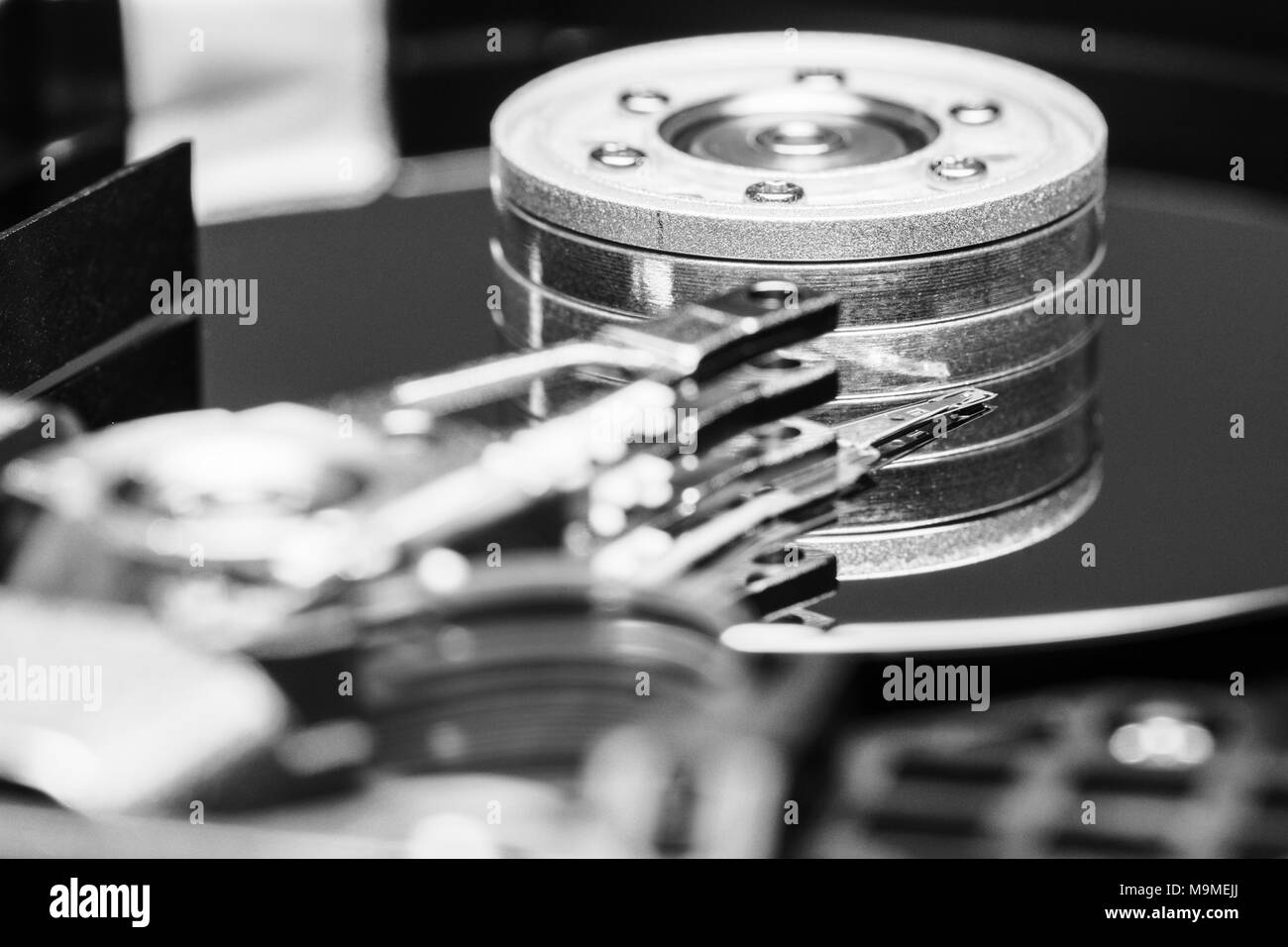 Hard disk drive inside close-up, spindle, actuator arm, read write head ...