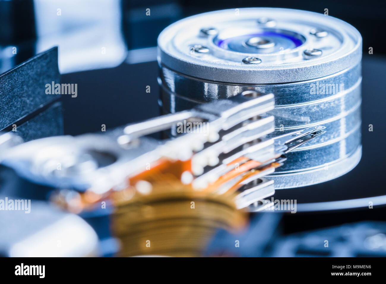 Hard disk drive inside close-up, spindle, actuator arm, read write head ...