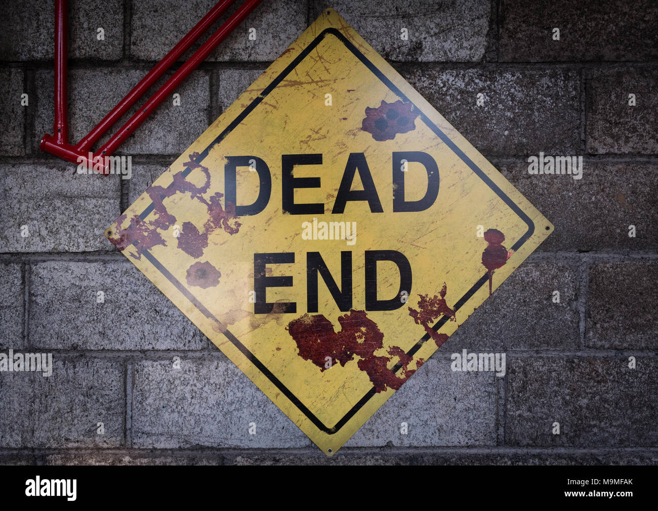 Weathered sign Dead End on the wall in workshop Stock Photo - Alamy