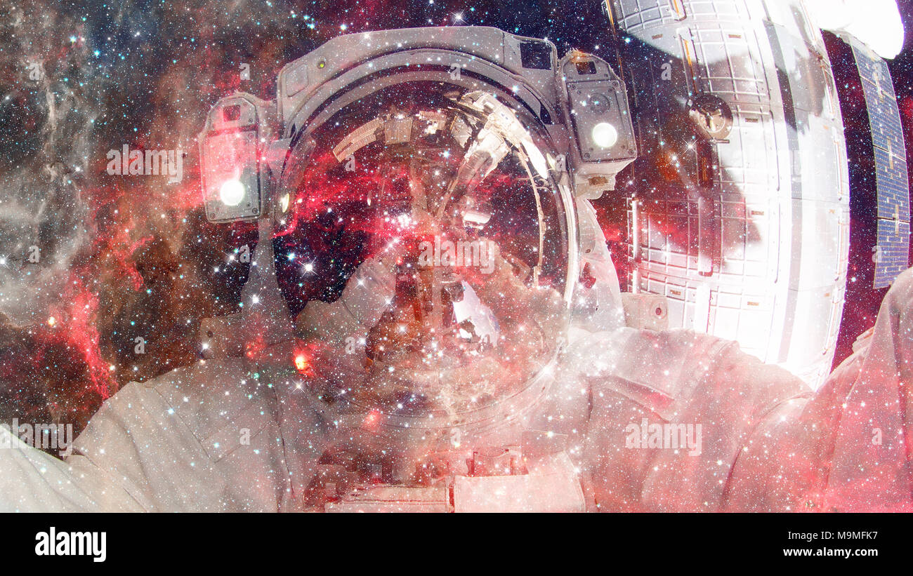 Astronaut in outer space. Science fiction art. Elements of this image ...