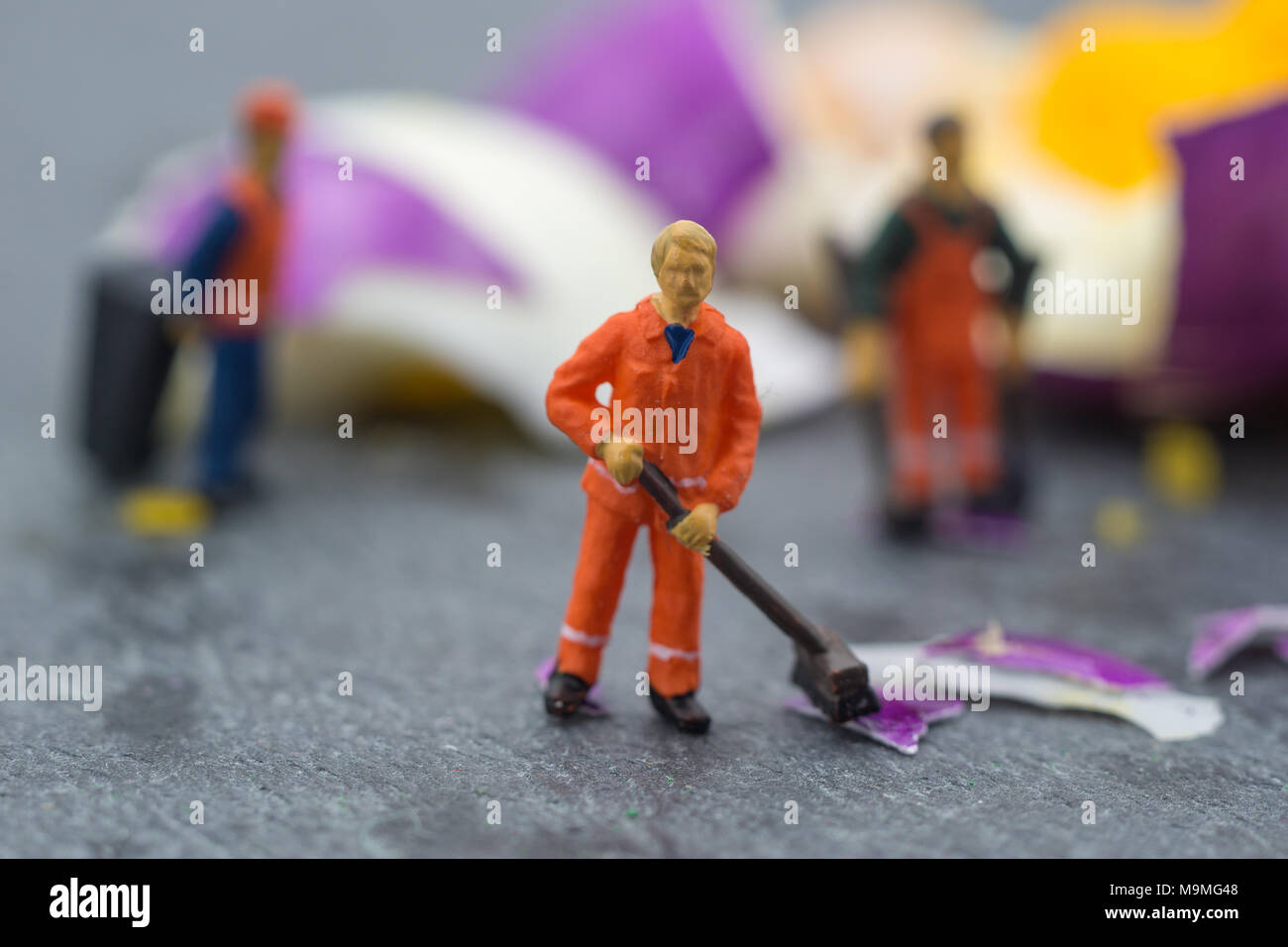 miniature worker people working on egg cleaning concept Stock Photo - Alamy