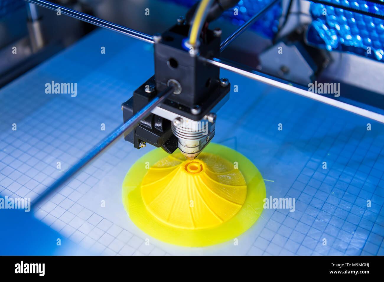 3D printer or additive manufacturing and robotic automation technology ...