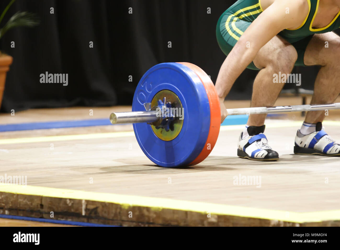 A weightlifter about to lift Stock Photo - Alamy
