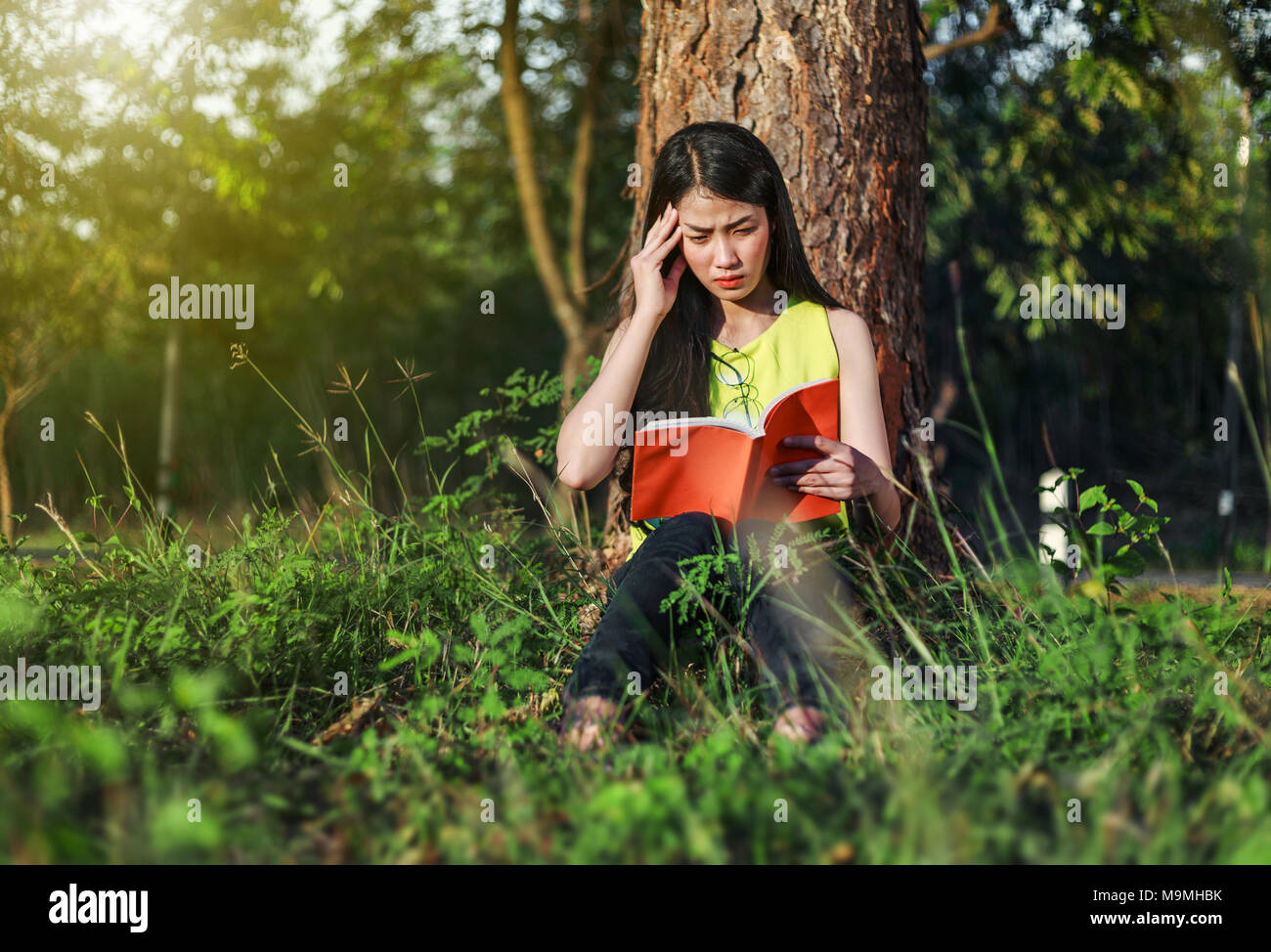 Stressed student reading book hi-res stock photography and images - Alamy