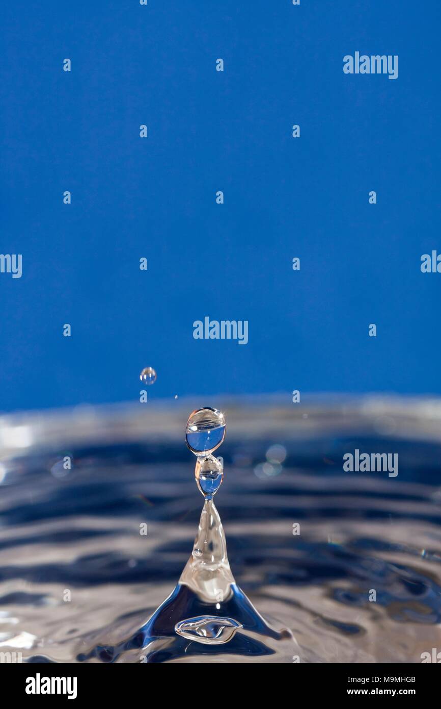 Splash, a drop falling in the water Stock Photo - Alamy