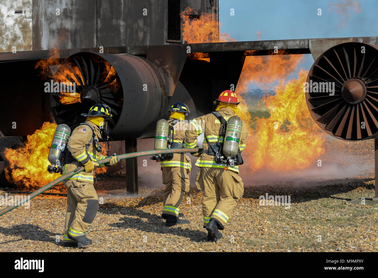 Firefighters from the 100th Civil Engineer Squadron, extinguish an ...