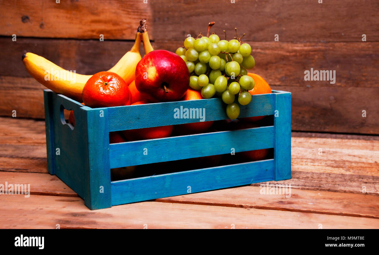 A wooden crate full of different fruits Stock Photo - Alamy