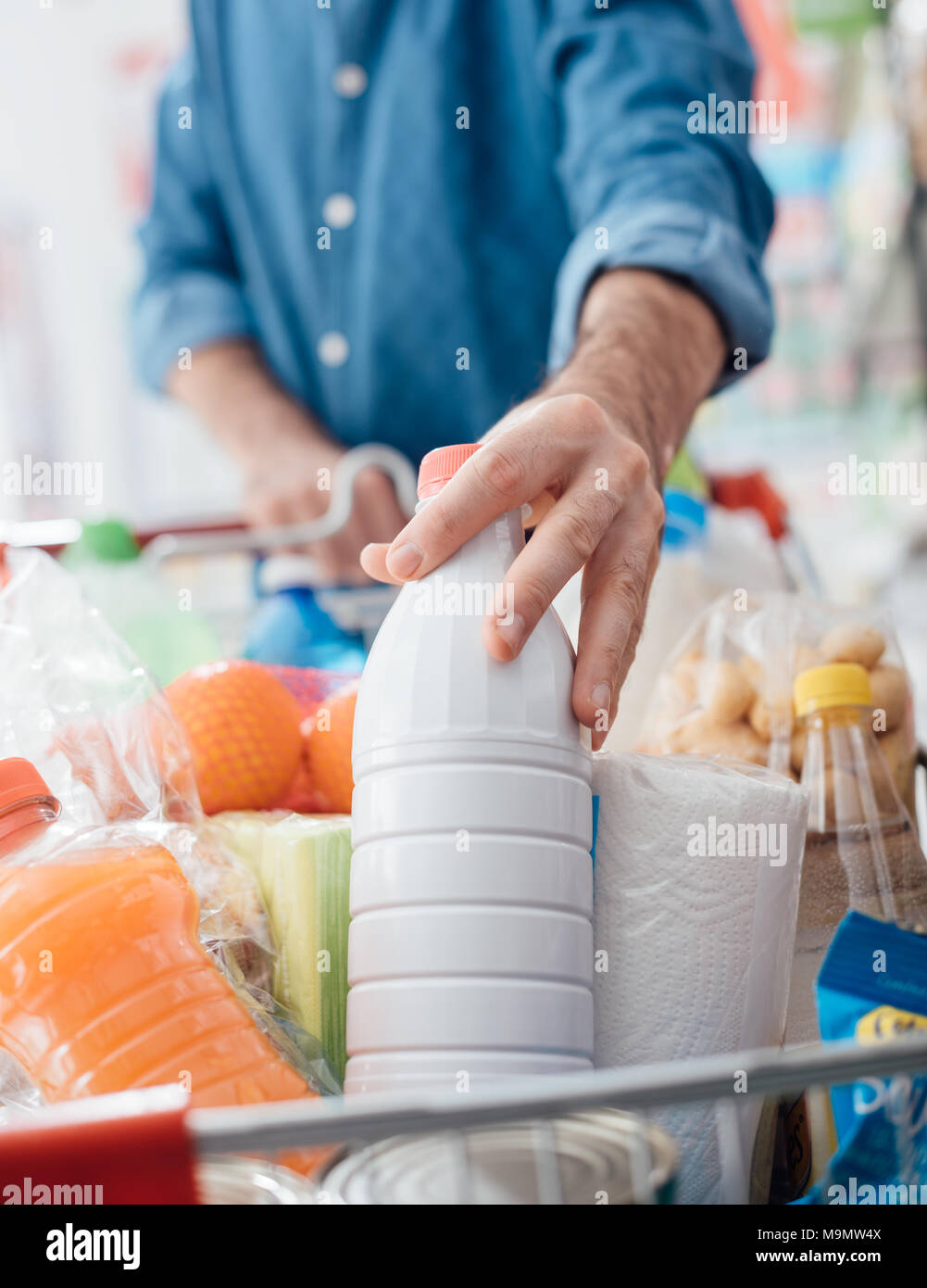 Putting milk in grocery cart hi-res stock photography and images - Alamy