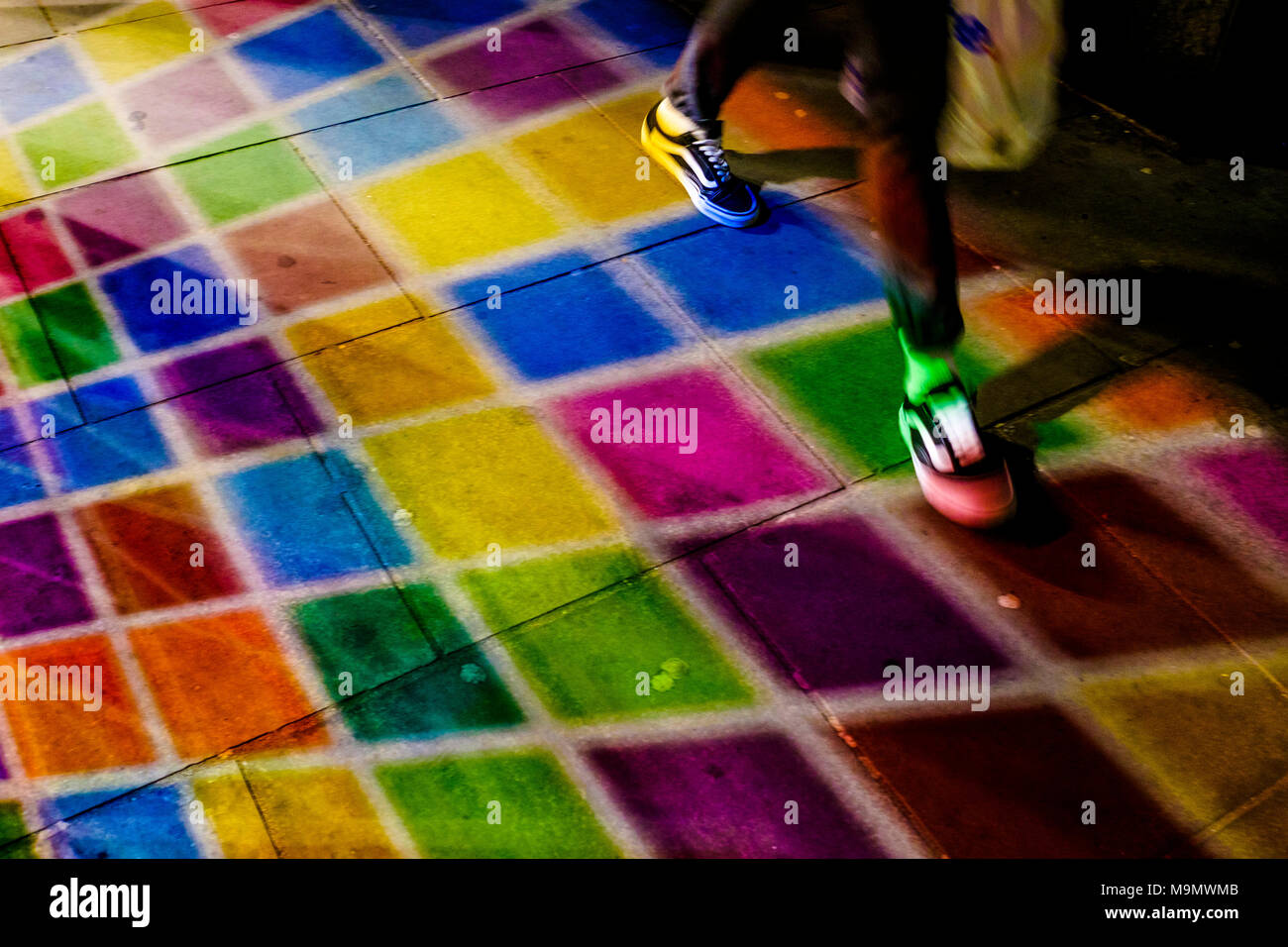 Pedestrians walking on a colourful sidewalk, London, England, Great ...