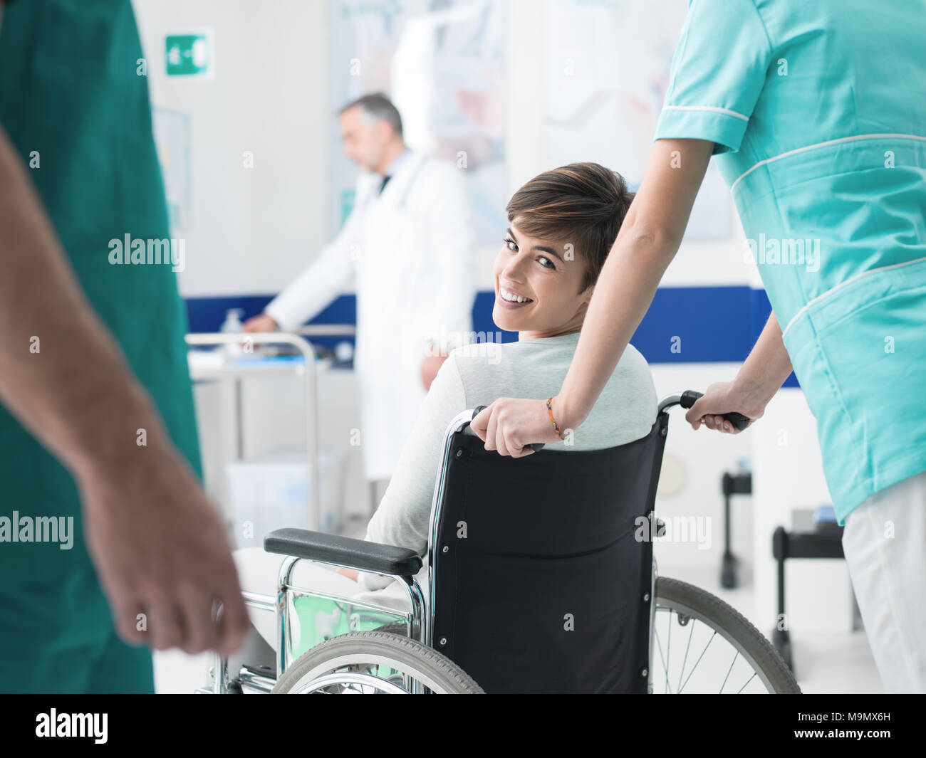 Smiling female disabled patient at the hospital meeting her doctor for ...