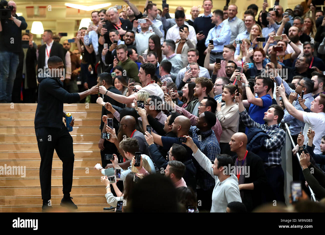 Anthony Joshua greets fans as he arrives at a press conference at Sky ...