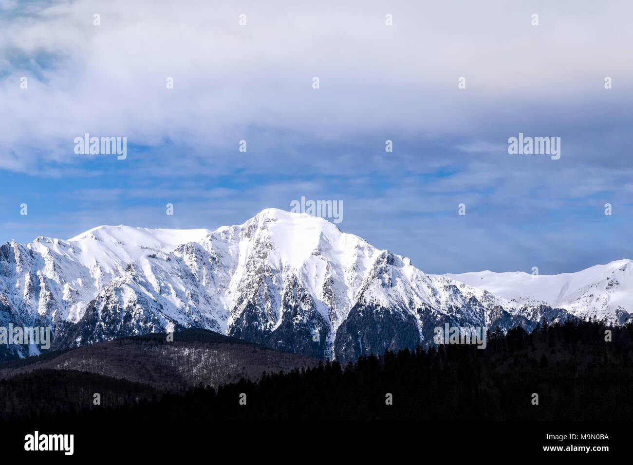 Snow peaks in the cloudy day Stock Photo - Alamy
