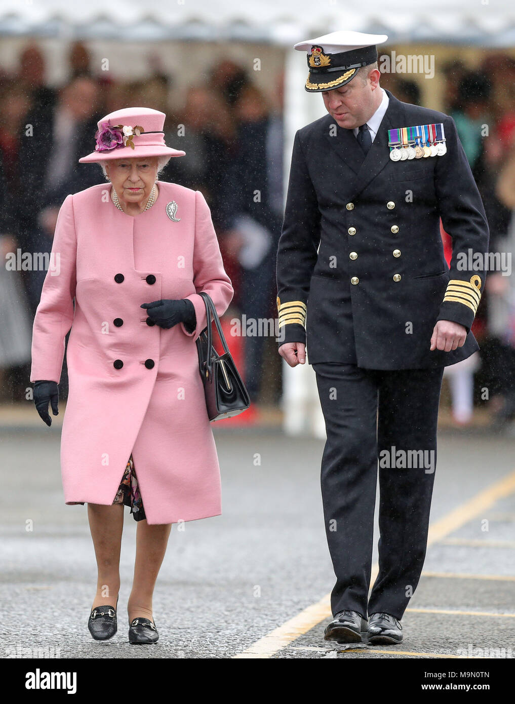 Queen Elizabeth II and Captain of HMS Ocean Captain Rob Pedre attends ...