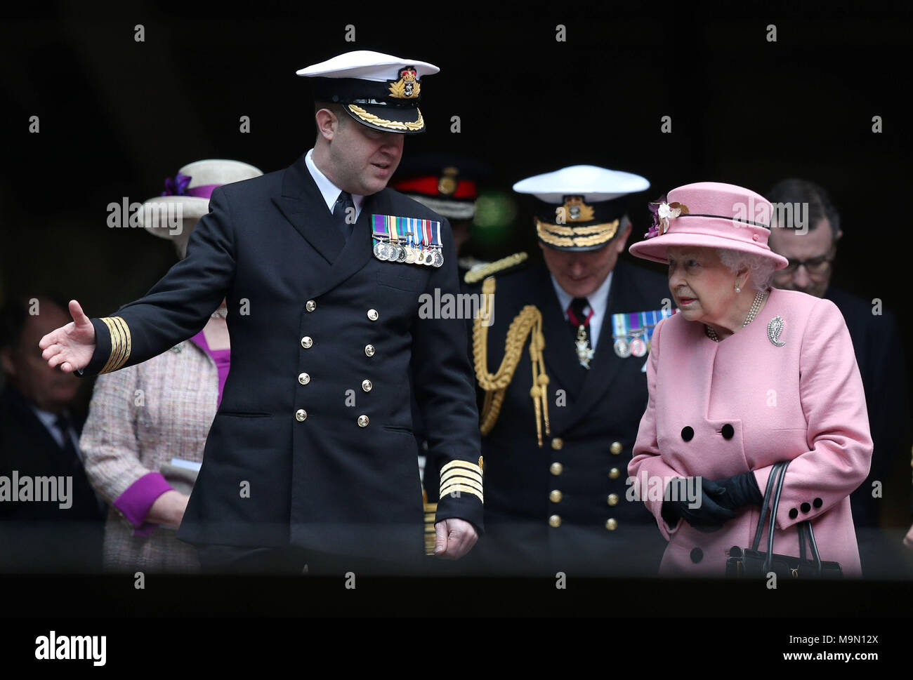 Queen Elizabeth II and Captain of HMS Ocean Captain Rob Pedre (left ...
