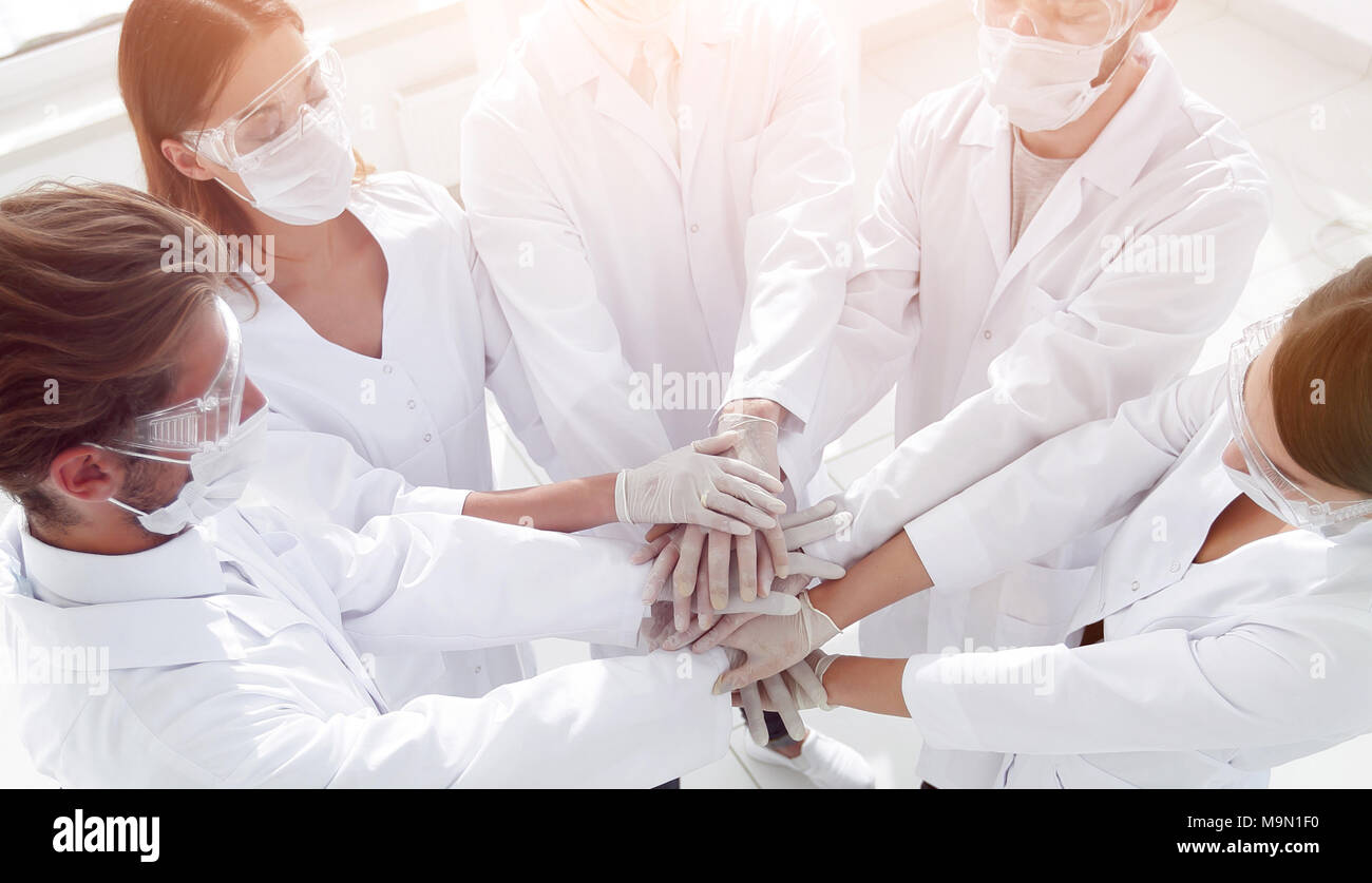 Health care workers demonstrating unity Stock Photo - Alamy