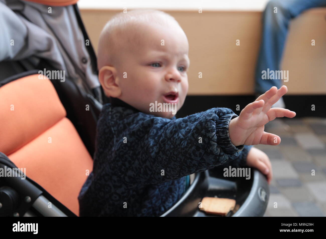 The child makes a gesture with his hand no Stock Photo - Alamy