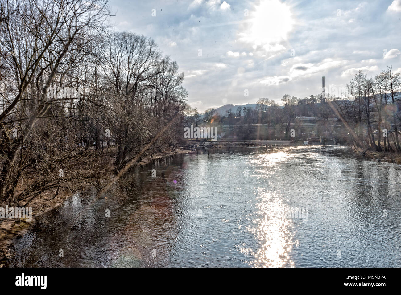 River Saale in Jena with sun in the background Stock Photo - Alamy