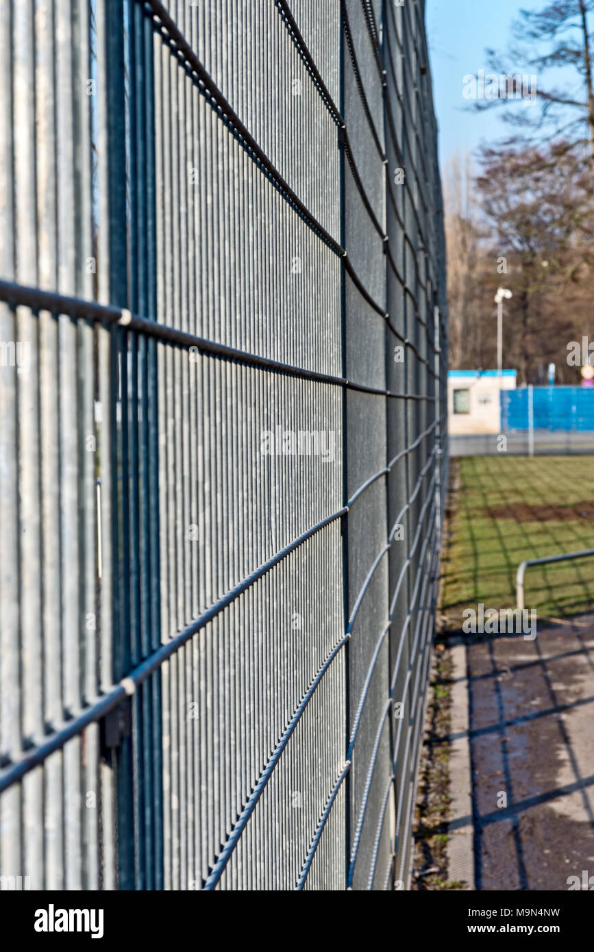 High fence to protect the property Stock Photo - Alamy
