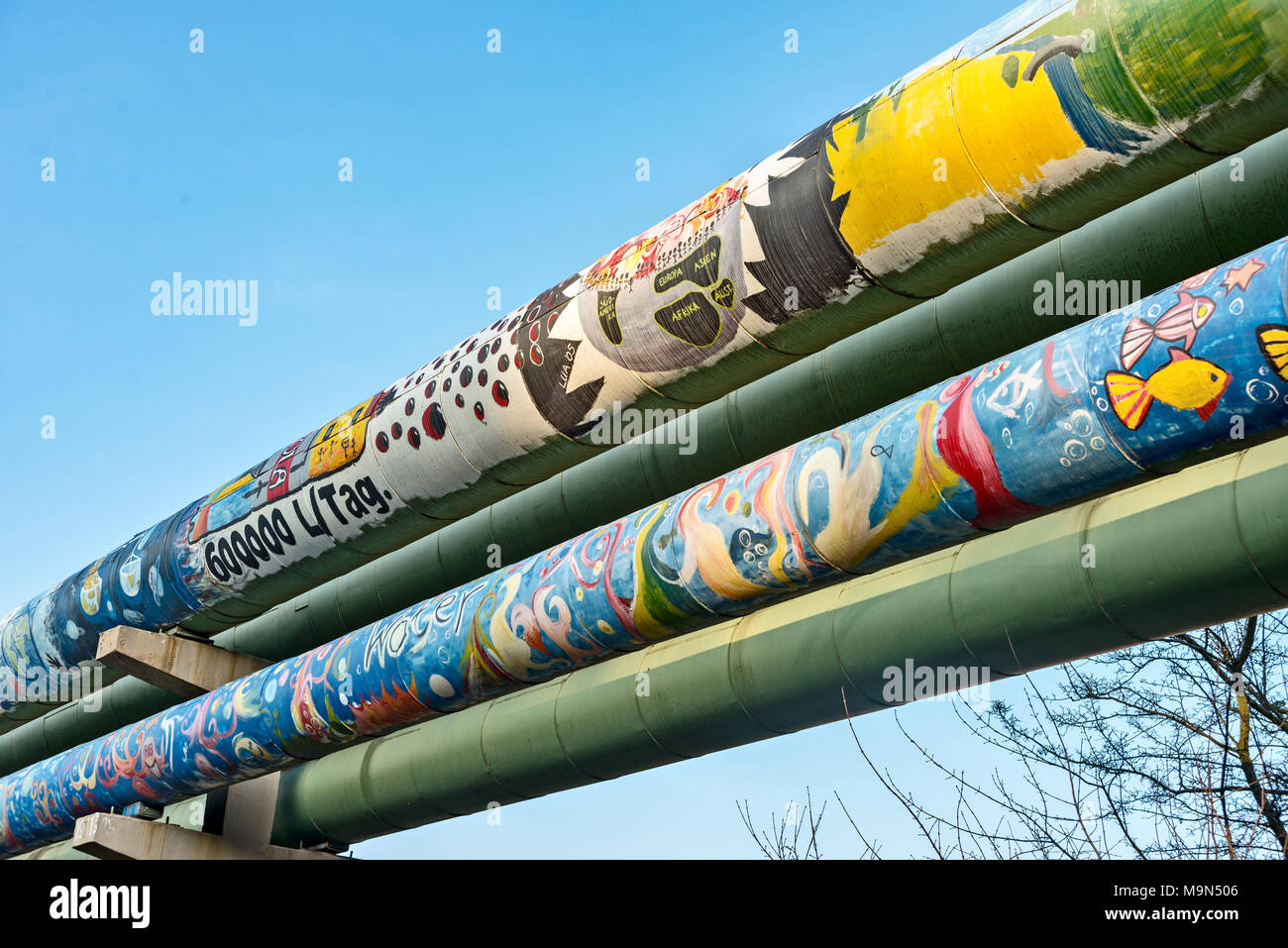 Heating pipes with graffiti Stock Photo - Alamy