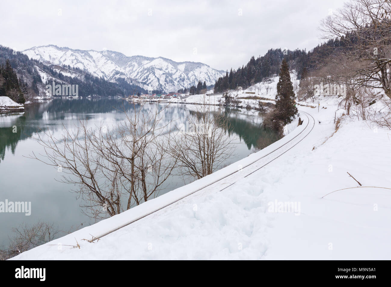 Train in Winter landscape snow on bridge Stock Photo - Alamy