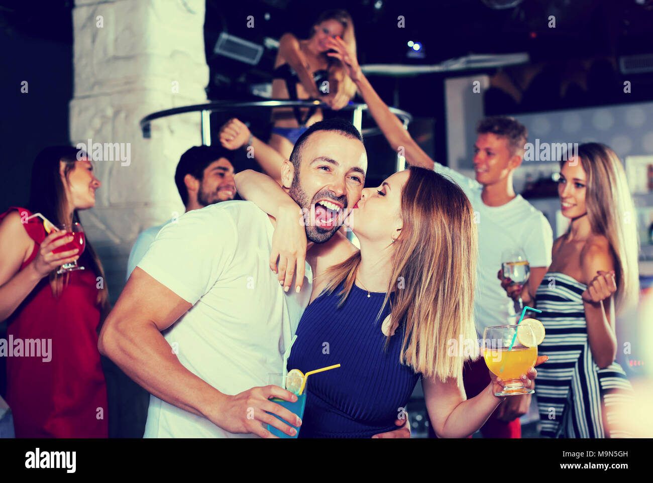 couple of happy people together in the night club with drinks Stock ...